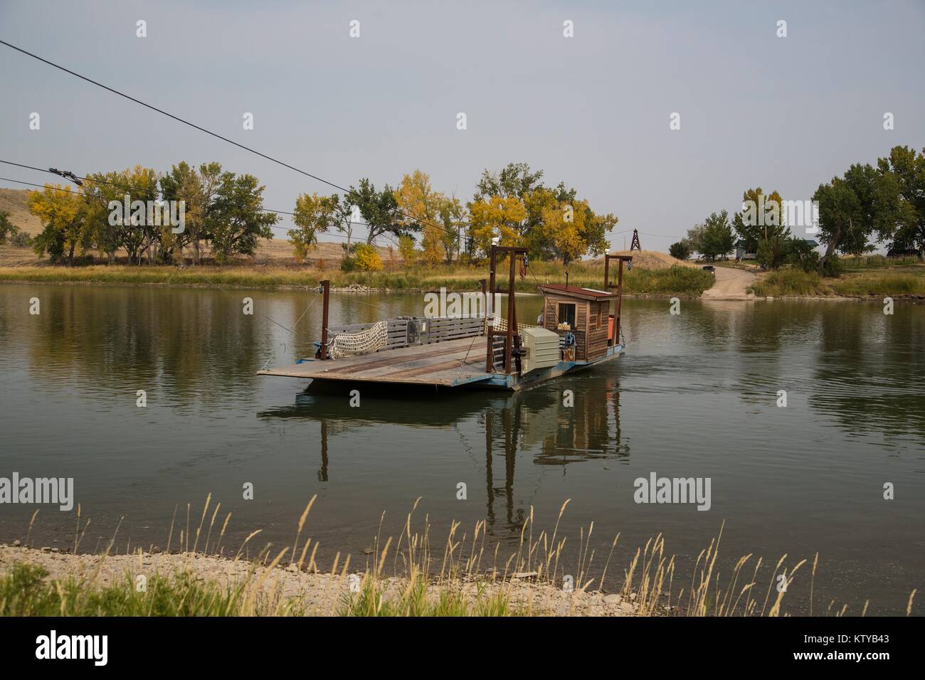 A boat ferries across the Upper Missouri National Wild and Scenic River ...