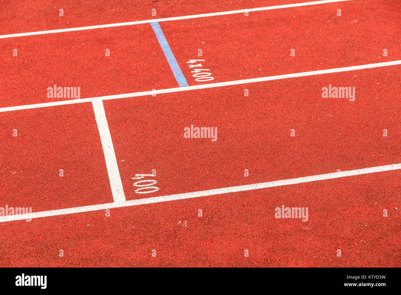 Empty red running track in stadium closeup Stock Photo - Alamy