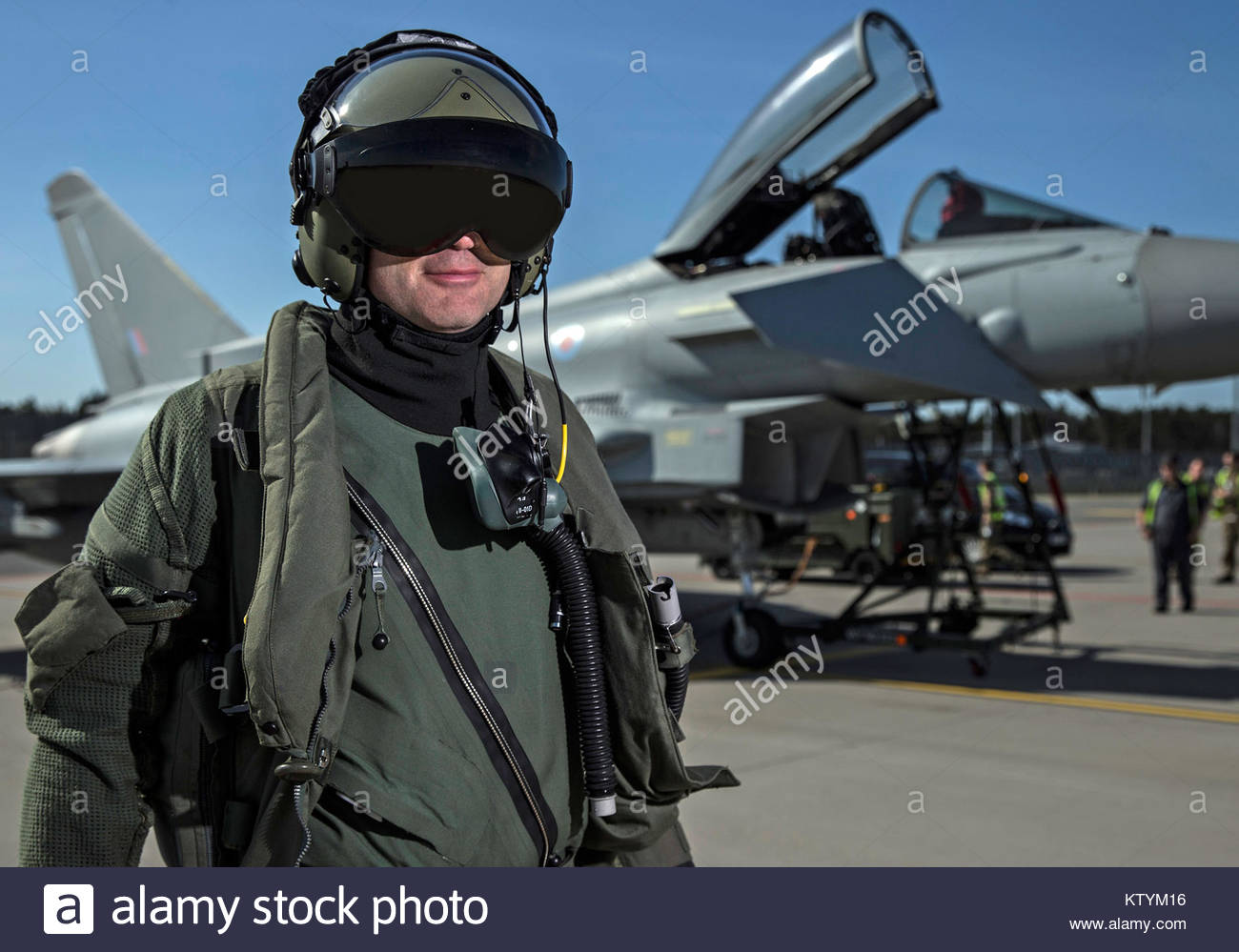 Pictured is a Royal Air Force Typhoon pilot in front of his Typhoon ...