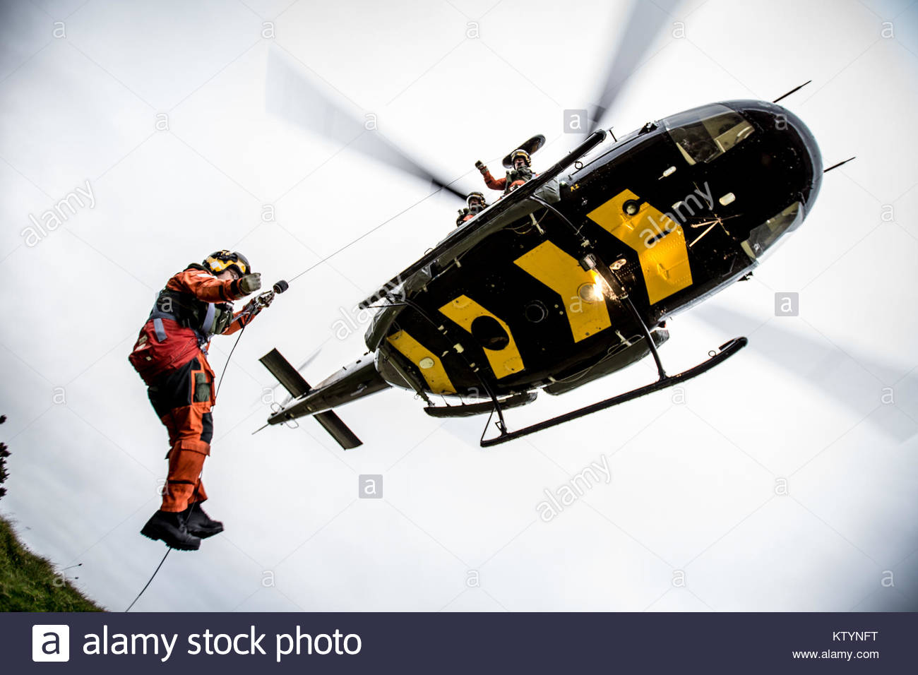 Rescue Helicopter Mountain Winch Stock Photos & Rescue Helicopter ...