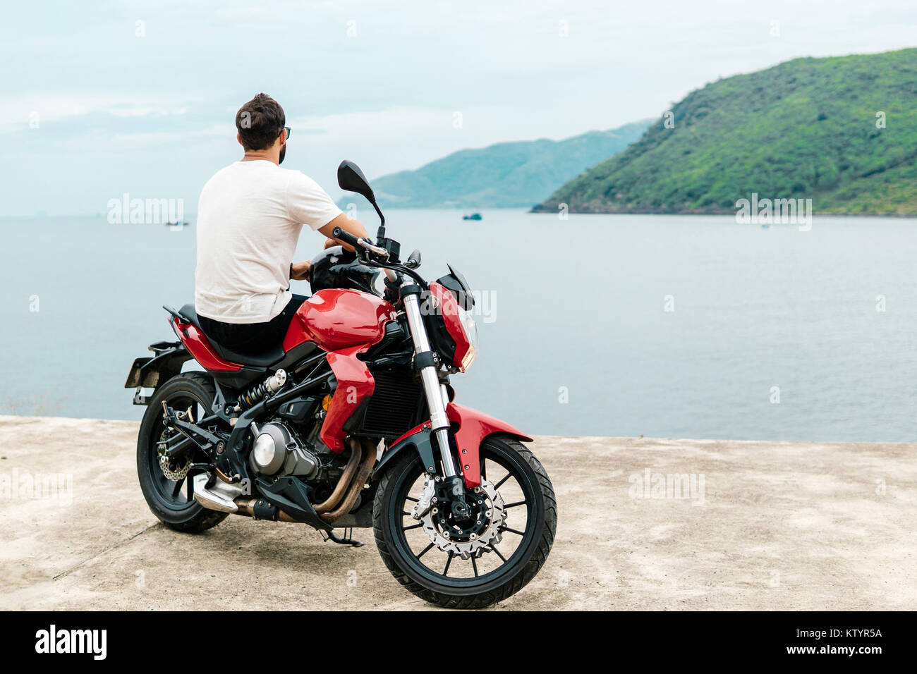 Motorcyclist sit on motorcycle hi-res stock photography and images - Alamy