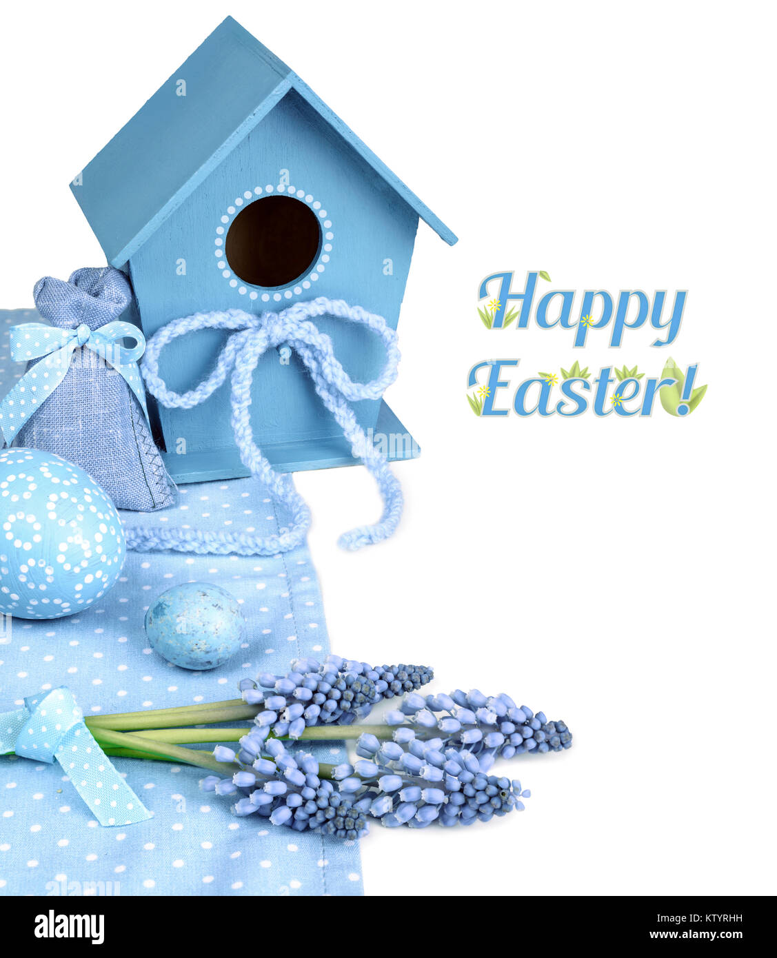 Blue Easter Border with grape hyacinth flowers, eggs and bird house ...