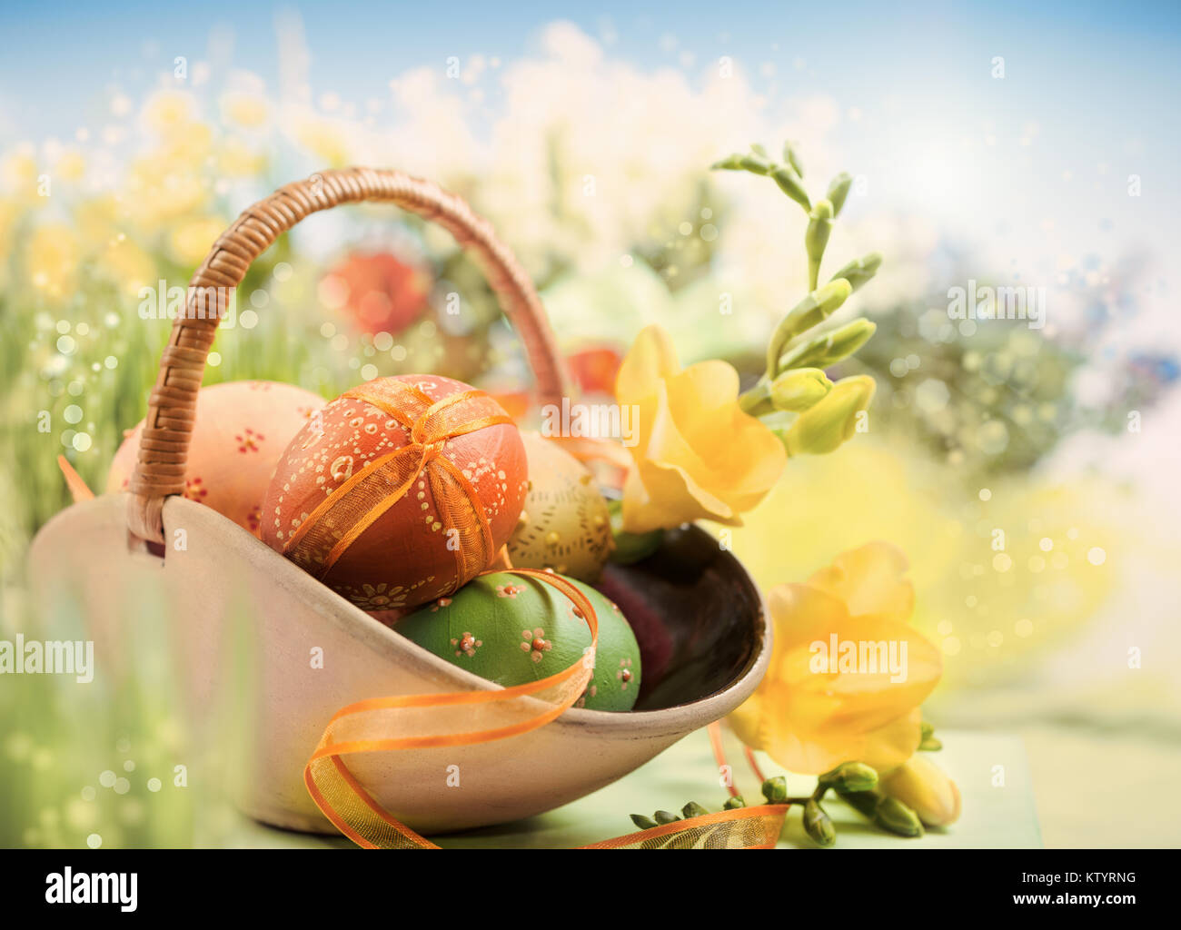 Easter background with eggs and spring flowers, shallow DOF, focus on ...