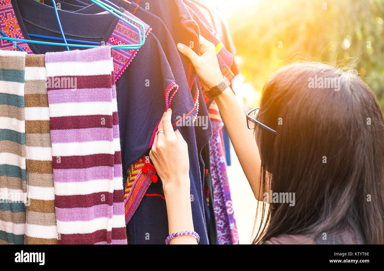 young female shopping local dress in market of far away country on the ...