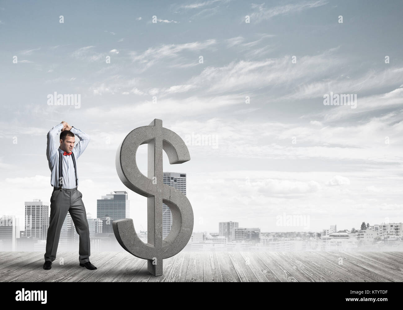 Determined banker man against modern cityscape breaking dollar cement ...