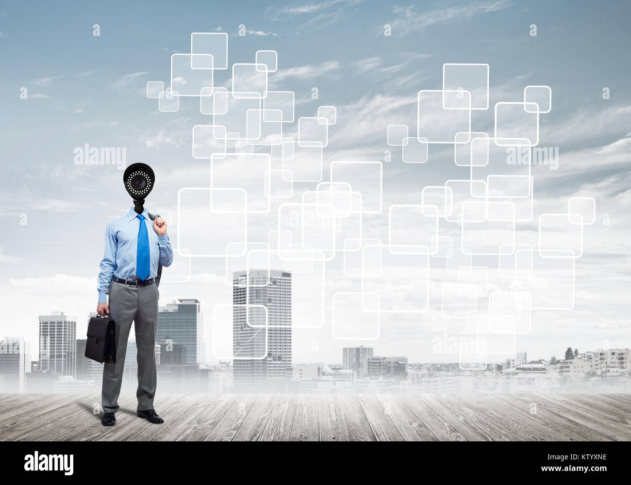 Camera headed man standing on wooden floor against modern cityscape ...