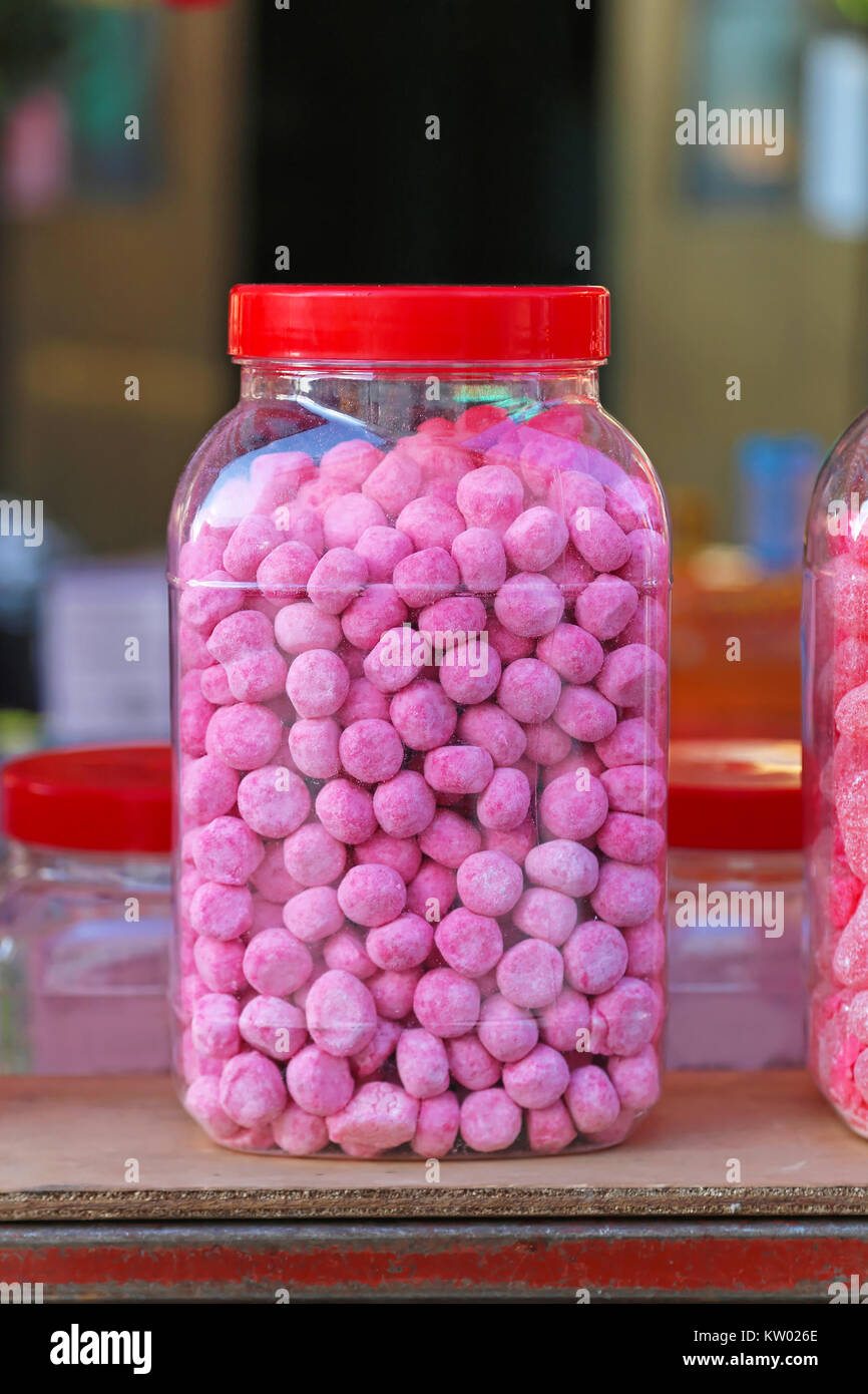 Big jar full of pink candy sweets Stock Photo - Alamy