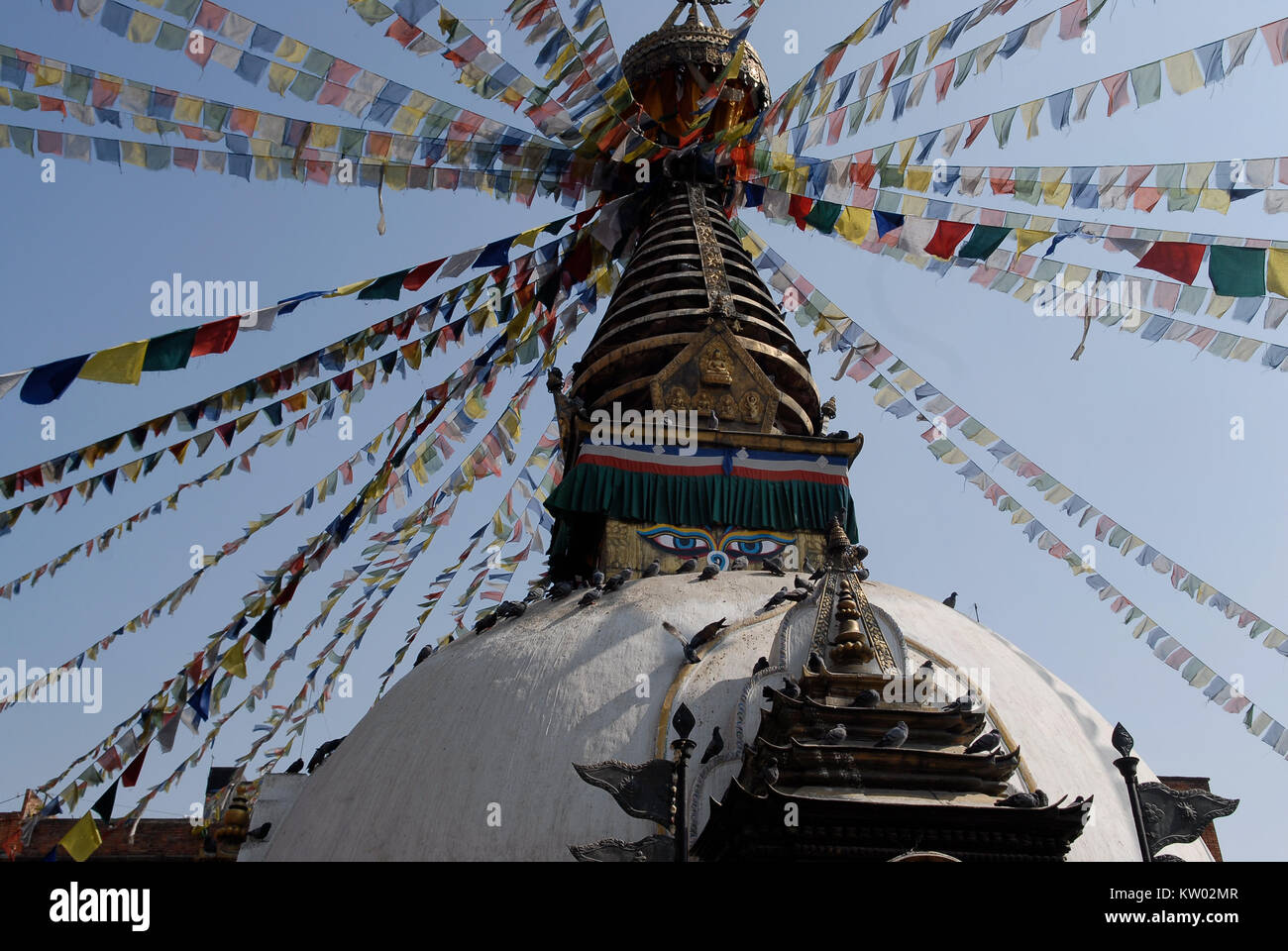 The Buddhist stupa, a white dome with a tower, the Buddha's face on the ...