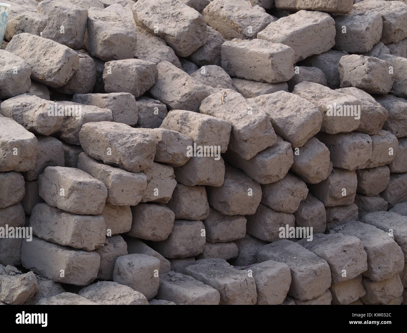Simple clay bricks of square and rectangular shape, folded into the ...
