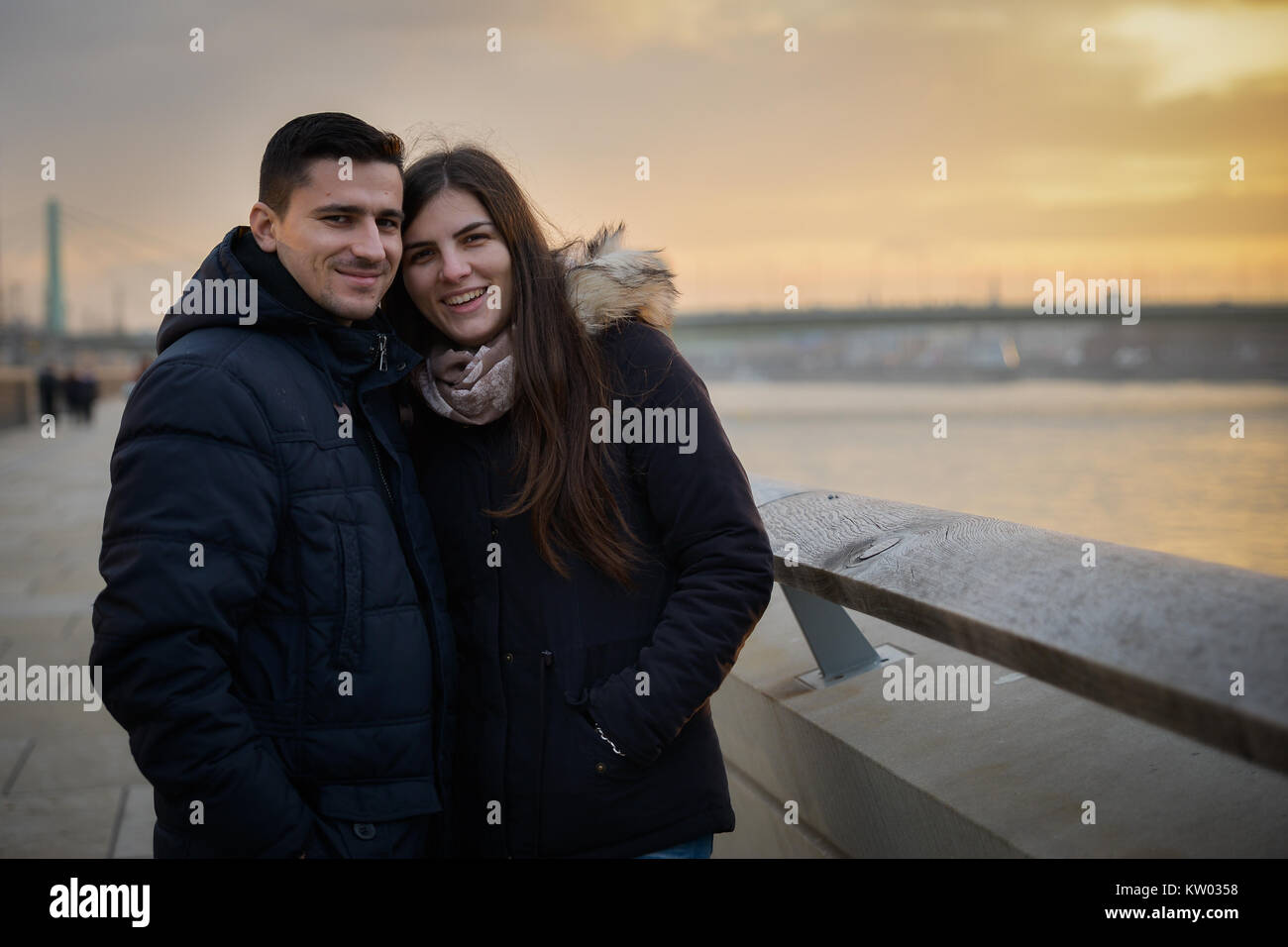 One girl and one boy in Cologne at sunset Stock Photo - Alamy