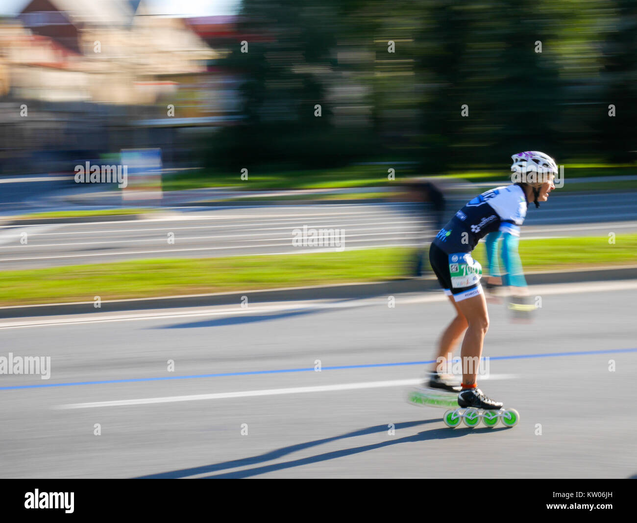 In line skater in move Stock Photo - Alamy