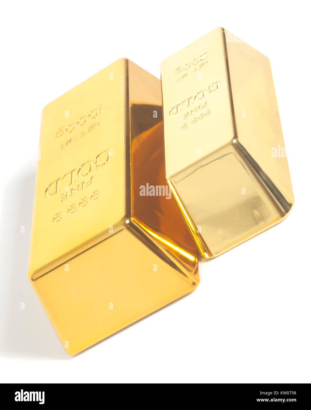 Gold bullion on a white background Stock Photo - Alamy