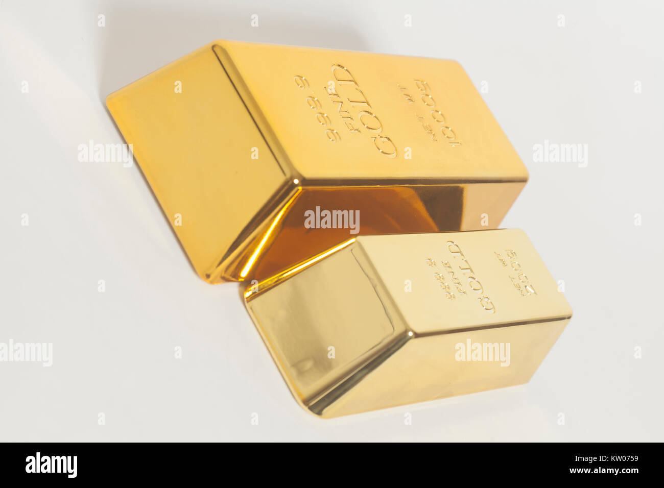 Gold bullion on a white background Stock Photo - Alamy