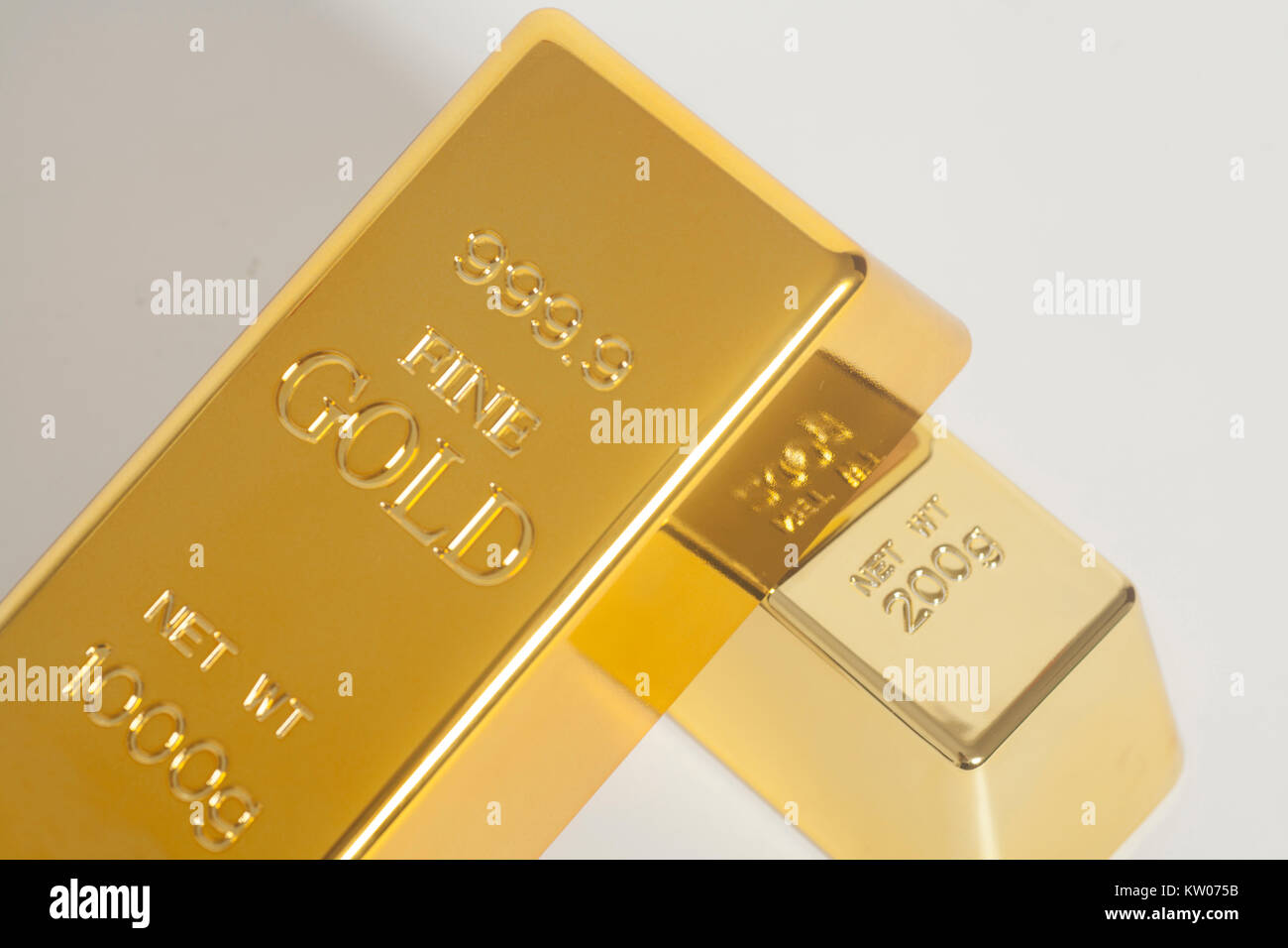 Gold bullion on a white background Stock Photo - Alamy