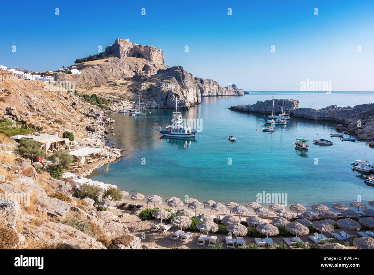 St. Paul´s bay with boats, Lindos acropolis in background (Rhodes ...