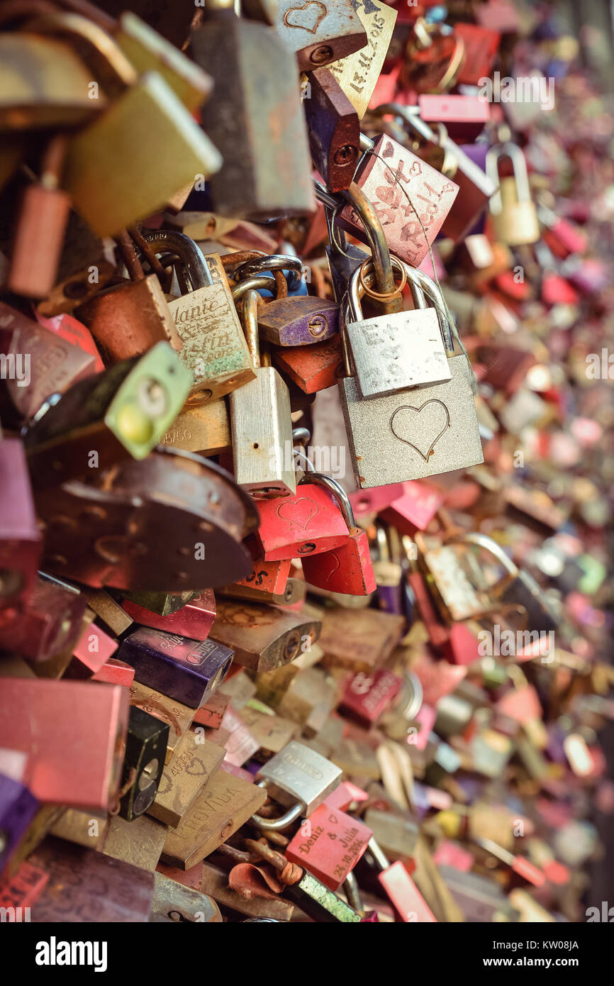 Locks put by tourist couples on a bridge in Cologne Stock Photo - Alamy