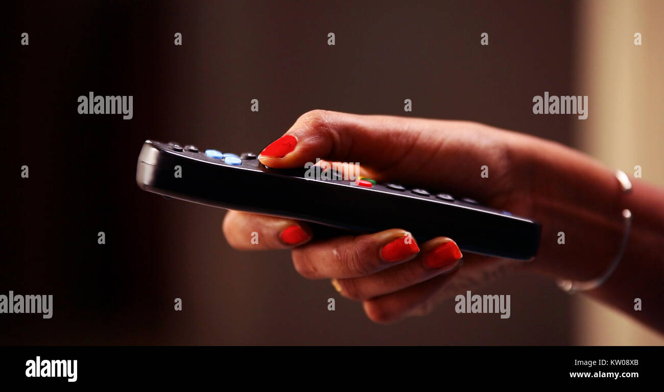 Close up Of TV Remote Changing Channels and Volume Increase, Teenage ...
