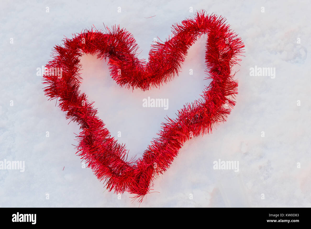 the symbol of love in the snow to remember that Valentine's day is in ...