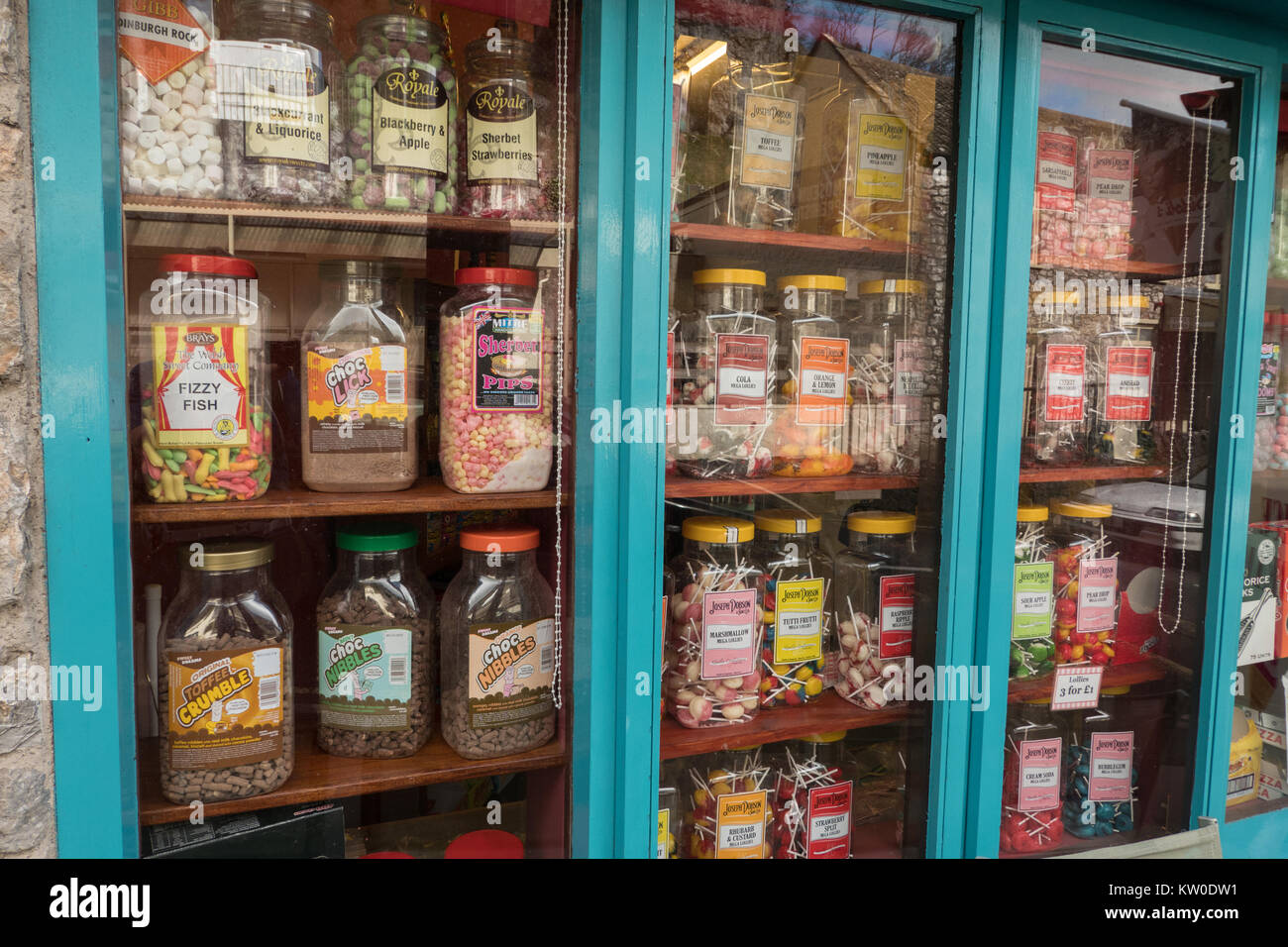 Sweet jars displayed in a sweet shop window, Cheddar, Somerset, England ...