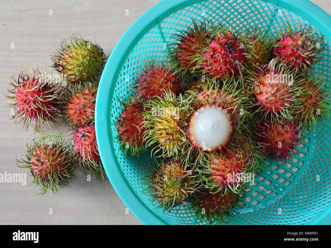 rambutan tropical fruit peel out on plastic basket Stock Photo - Alamy
