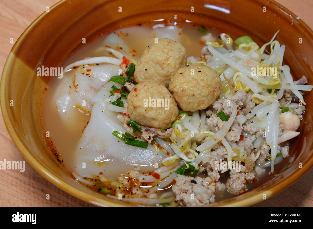 large rice noodle topping shrimp ball in soup Stock Photo - Alamy