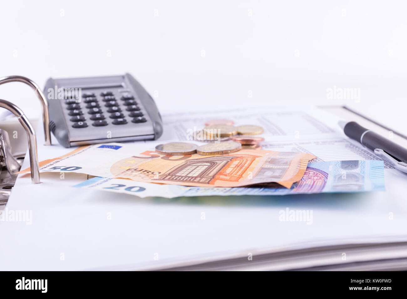 check with calculator and pay the bill with money Stock Photo - Alamy