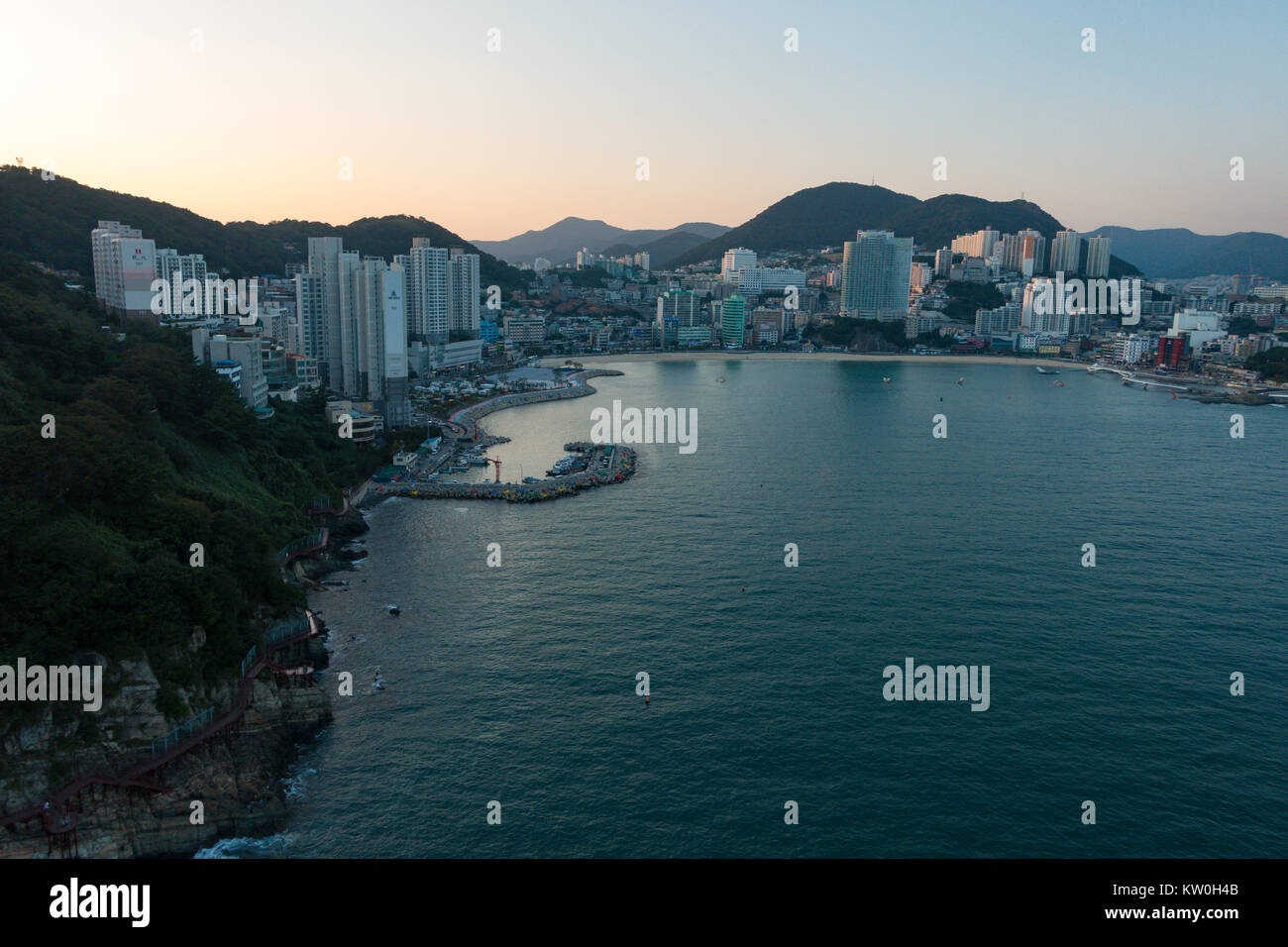Aerial view of Songdo beach and Busan city in the sunset from the cable ...