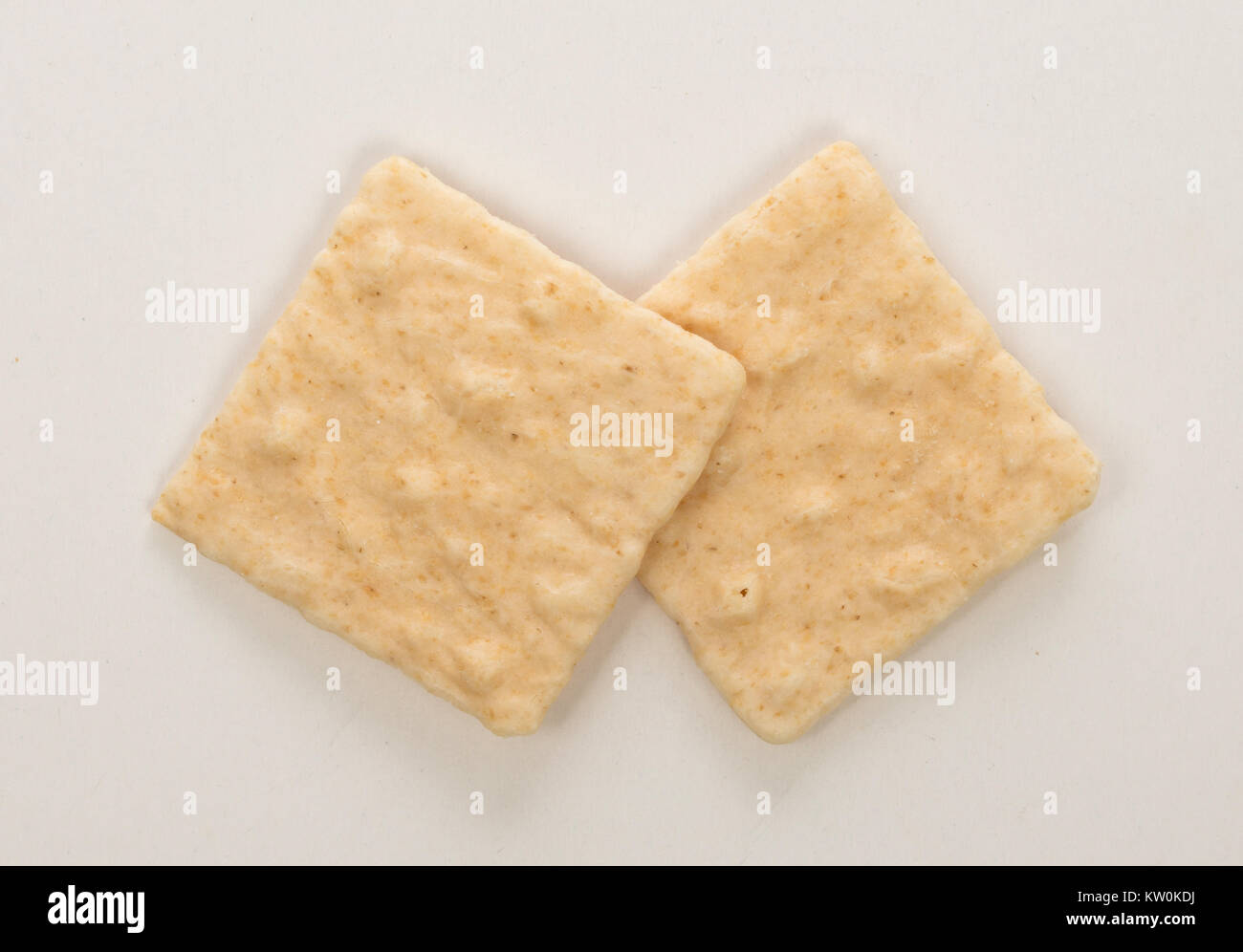 Simple square crackers isolated on a white background Stock Photo - Alamy