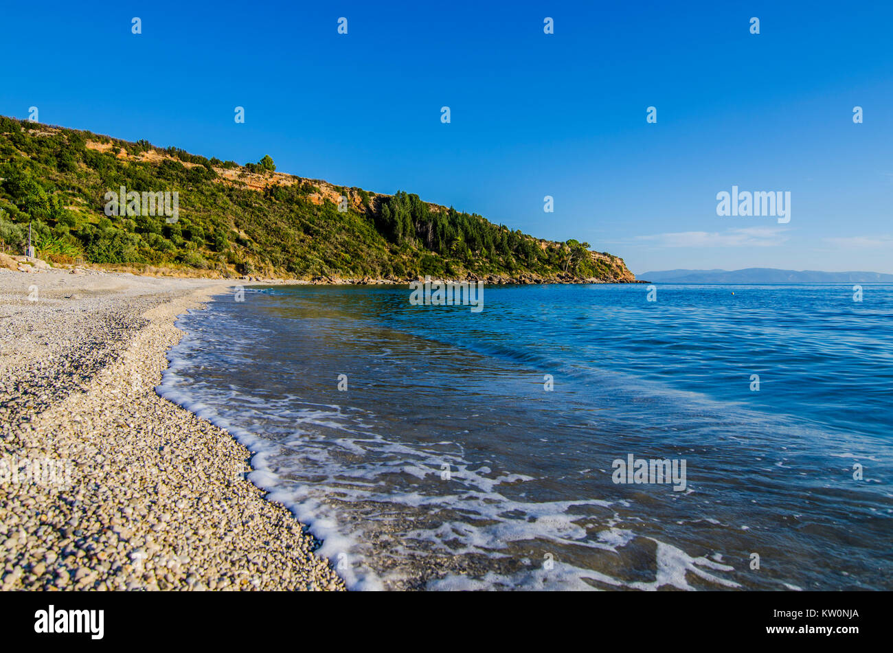 coastline and beach of Lourdata stones at sunset over the Ionian sea on ...