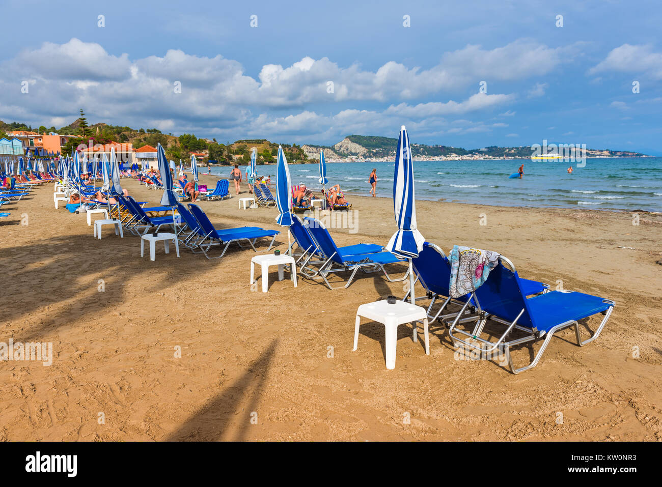 ZAKYNTHOS, GREECE - September 28, 2017: Parasols and sunbeds on Argassi ...