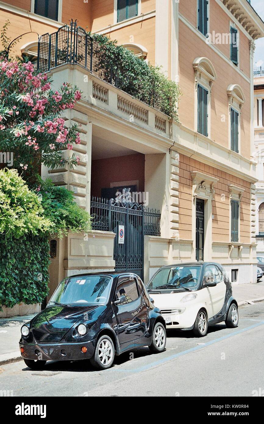 Mini cars seen throughout Italy and Rome. Efficient small vehicles help ...