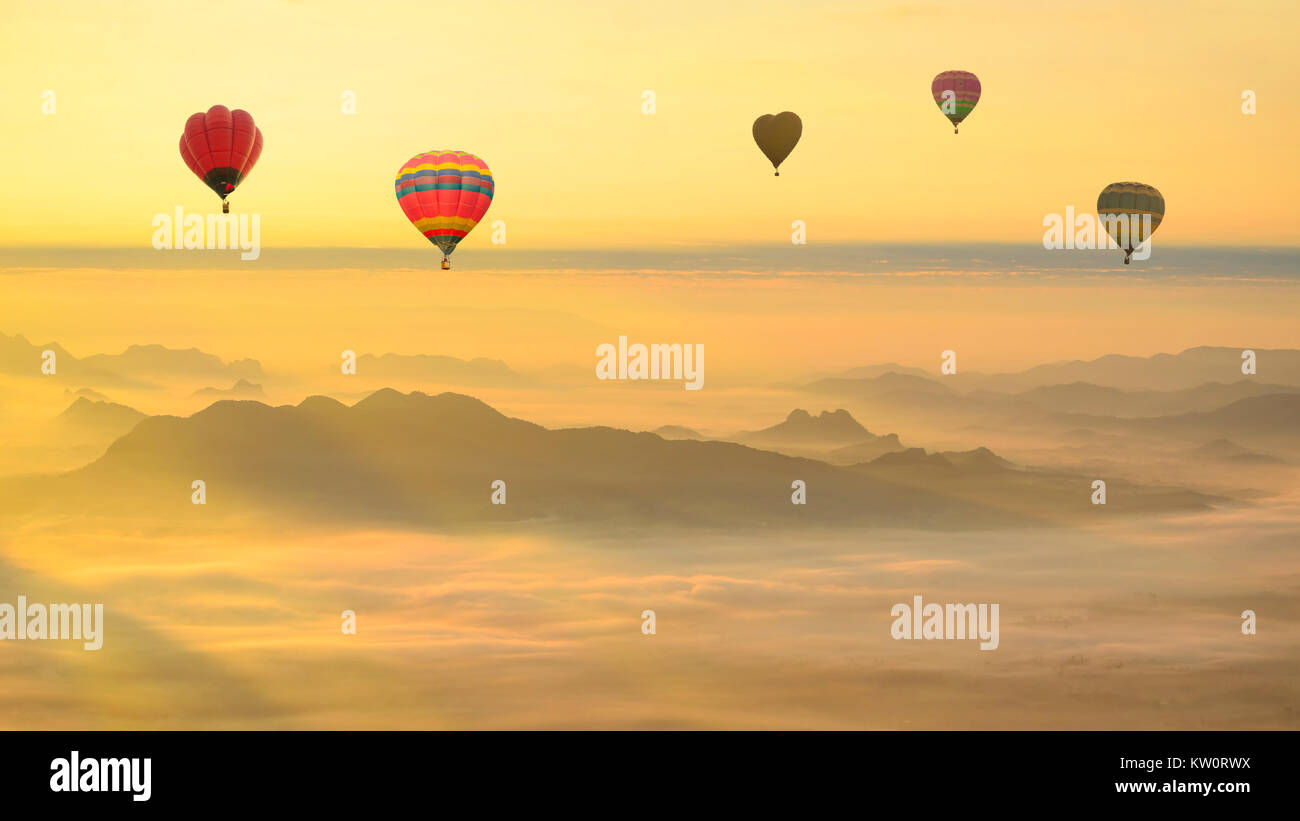 Hot air balloon over the sea of mist Stock Photo - Alamy