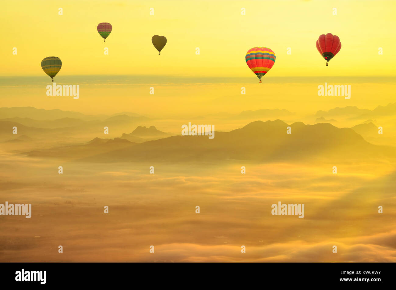 Hot air balloon over the sea of mist Stock Photo - Alamy