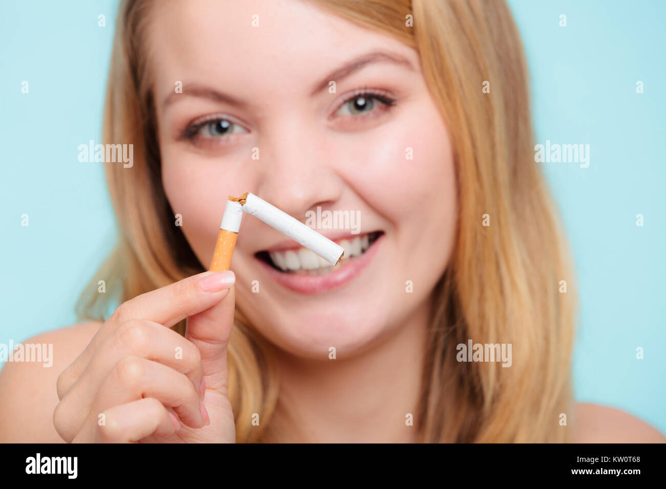 Smilling woman breake down cigarette. Winning with addicted nicotine ...