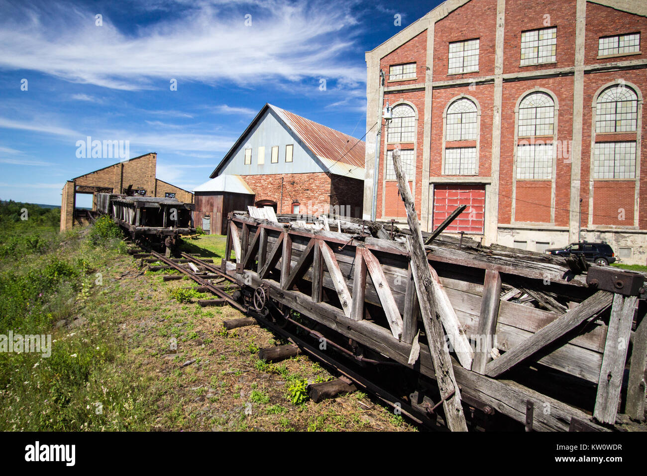 Abandoned mine cars and buildings at the Quincy Copper Mine in Michigan ...
