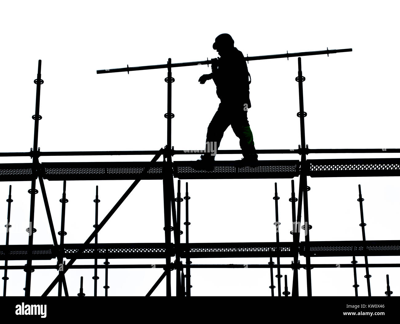 Scaffolders at work, building a large scaffolding, work at high ...