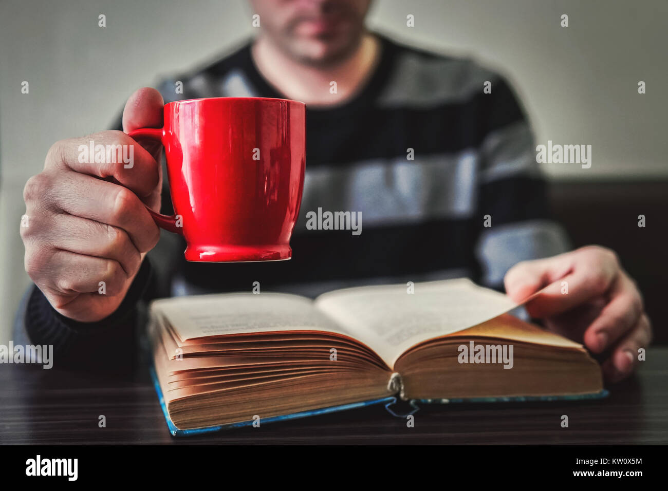 Man in caffe restaurant reading book. Tea reading a novel. Tea time ...