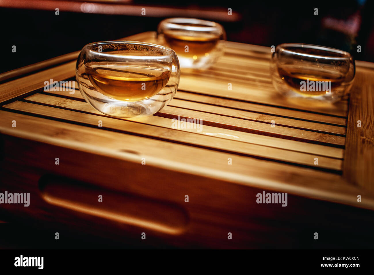 Three glass cups with tea Stock Photo - Alamy