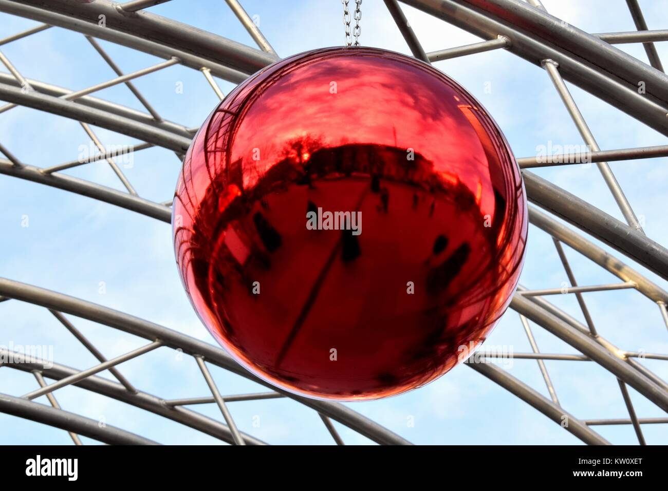 red shiny ball with a reflection of street on metal construction Stock ...