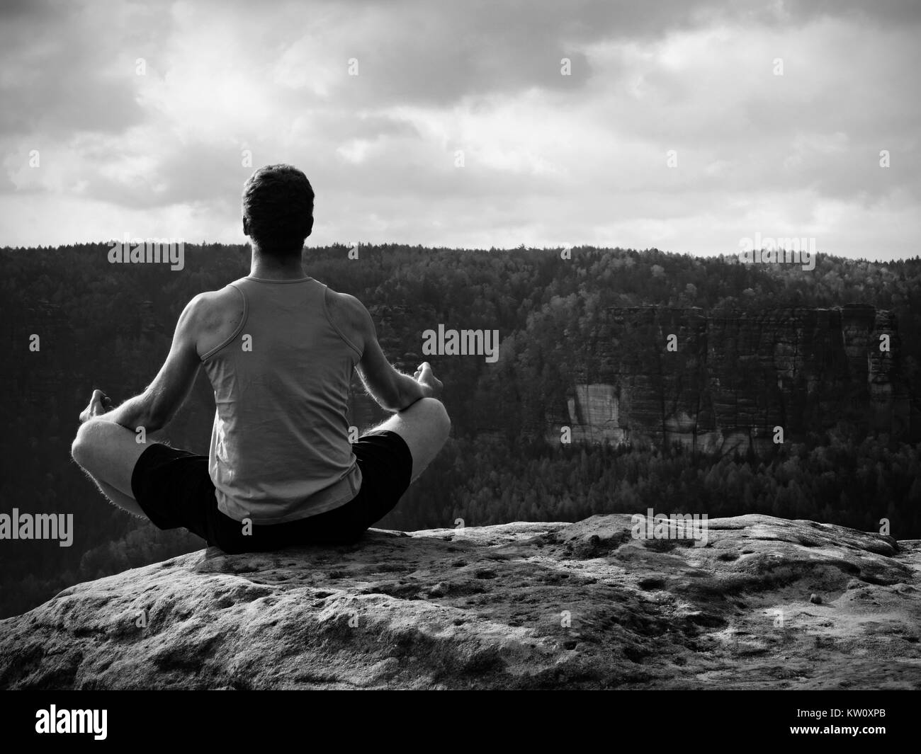 Man meditating on mountain top High Resolution Stock Photography and ...