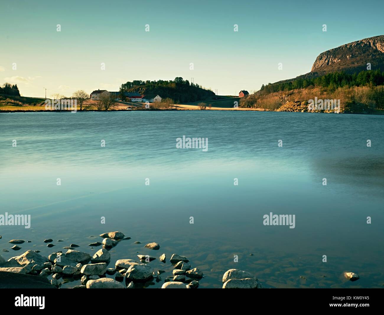 Beautiful view on norwegian bay with traditional houses along rocky ...
