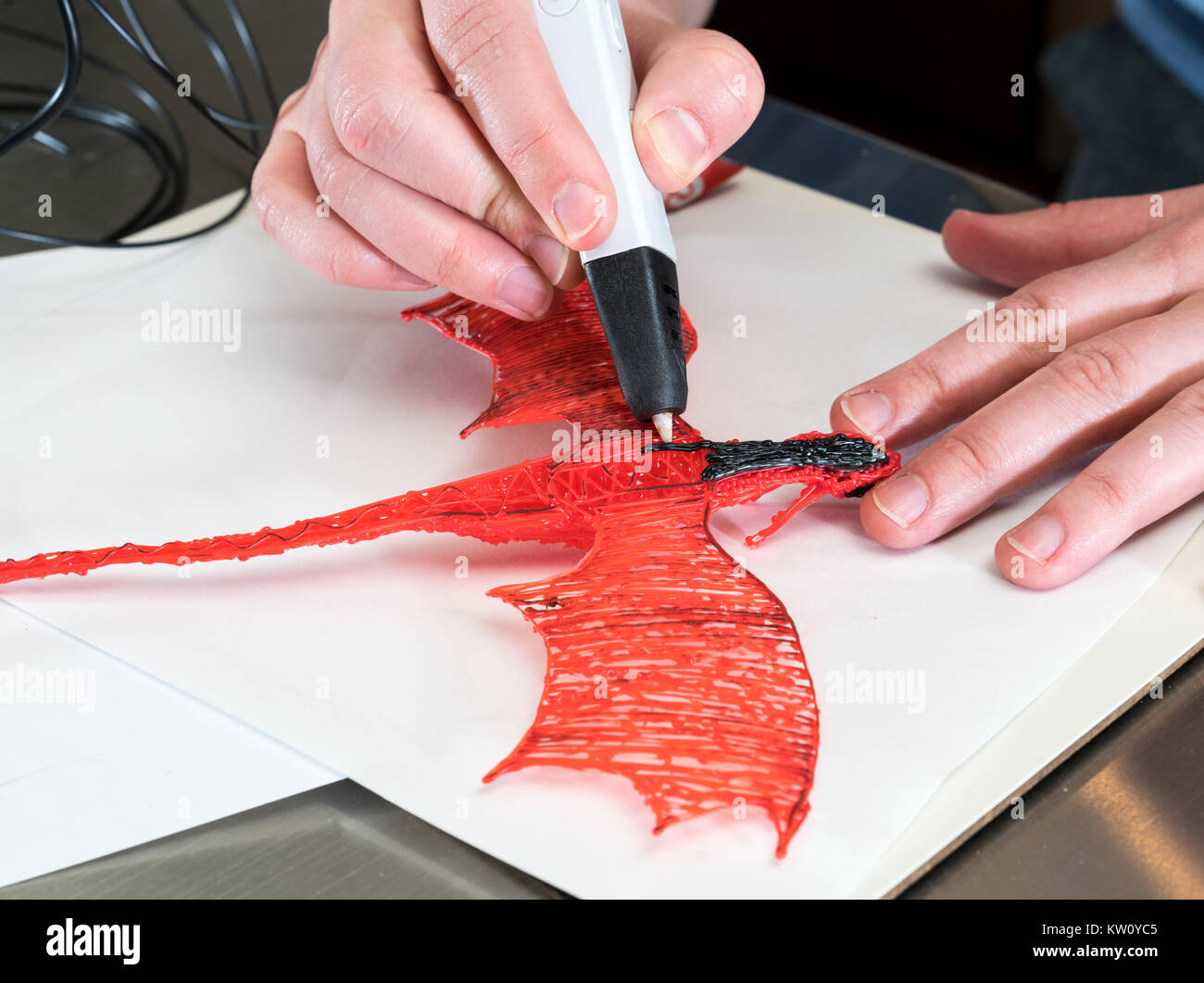 3-D printing pen creating a dragon shape Stock Photo - Alamy