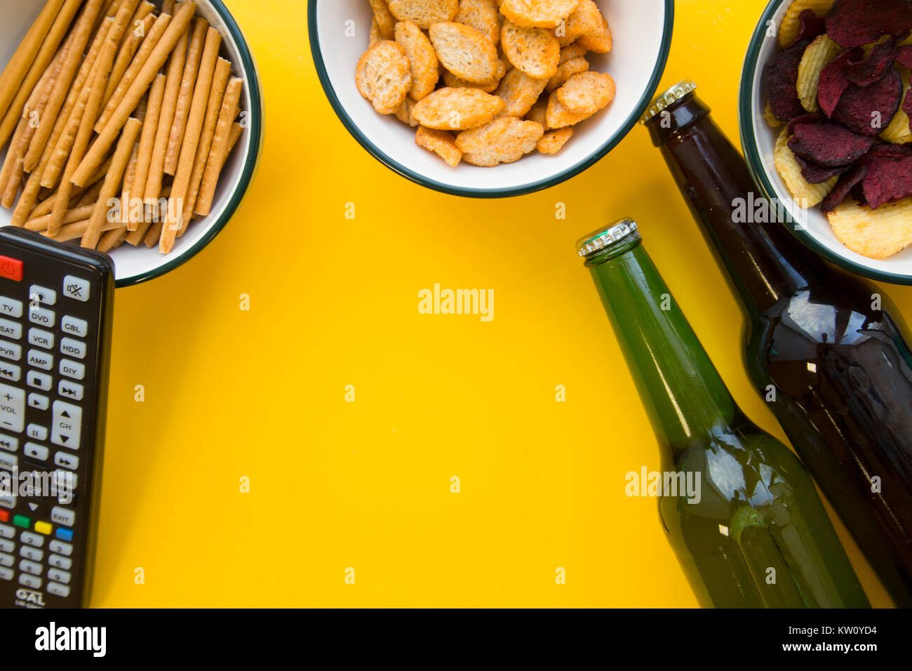 Watching sport channel with friends. Three bowls with delicious crunchy ...