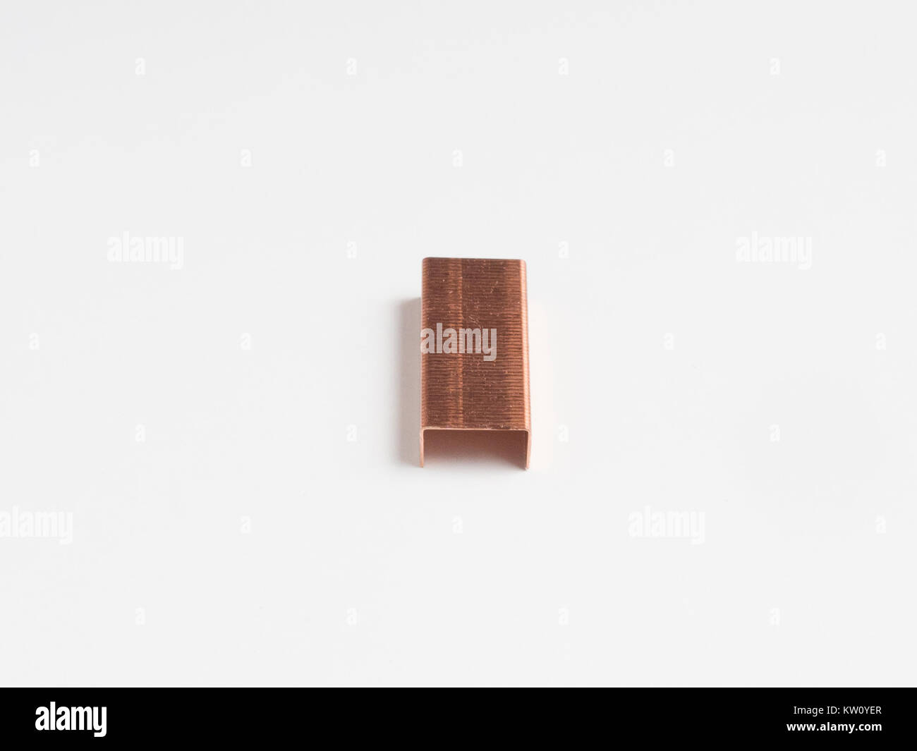 Staples on white background Stock Photo - Alamy
