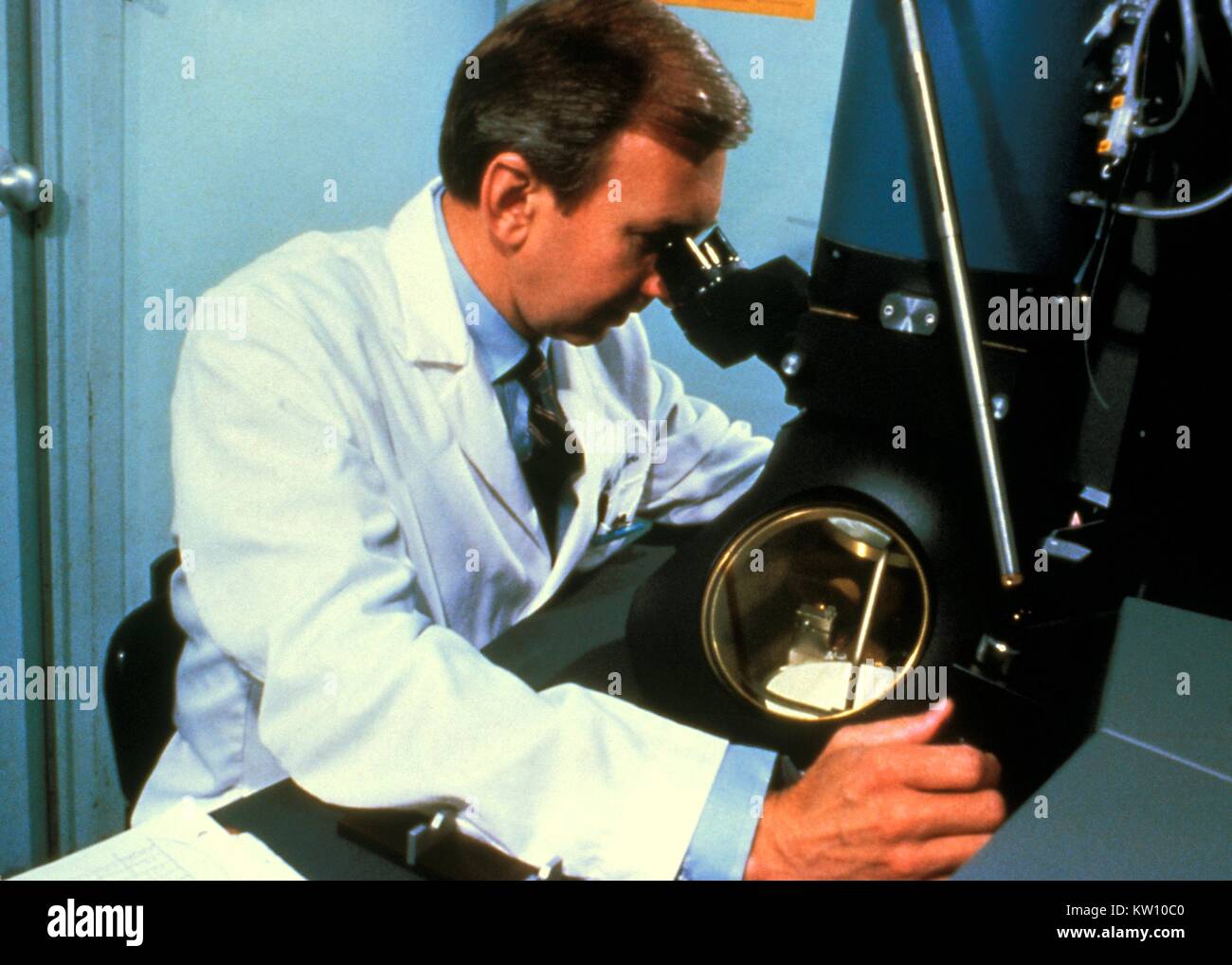 This CDC lab technician is carrying out AIDS research during 1988 ...