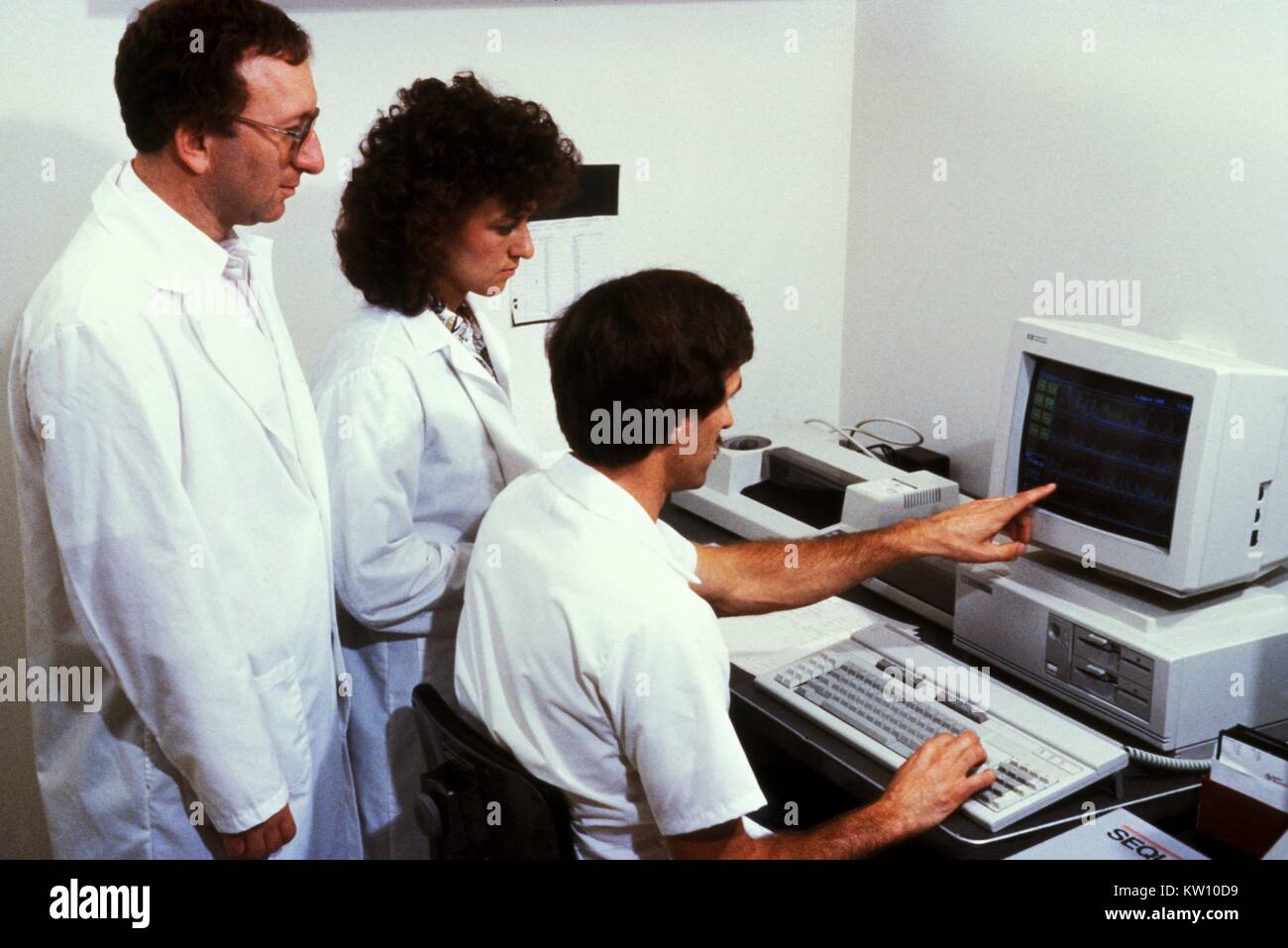 These CDC lab technicians are working on AIDS research during a series ...