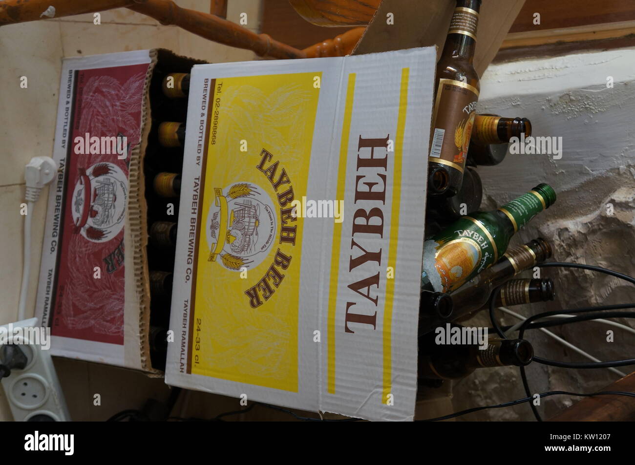 A box full of empty bottles of Taybeh Beer in the Taybeh Brewing ...