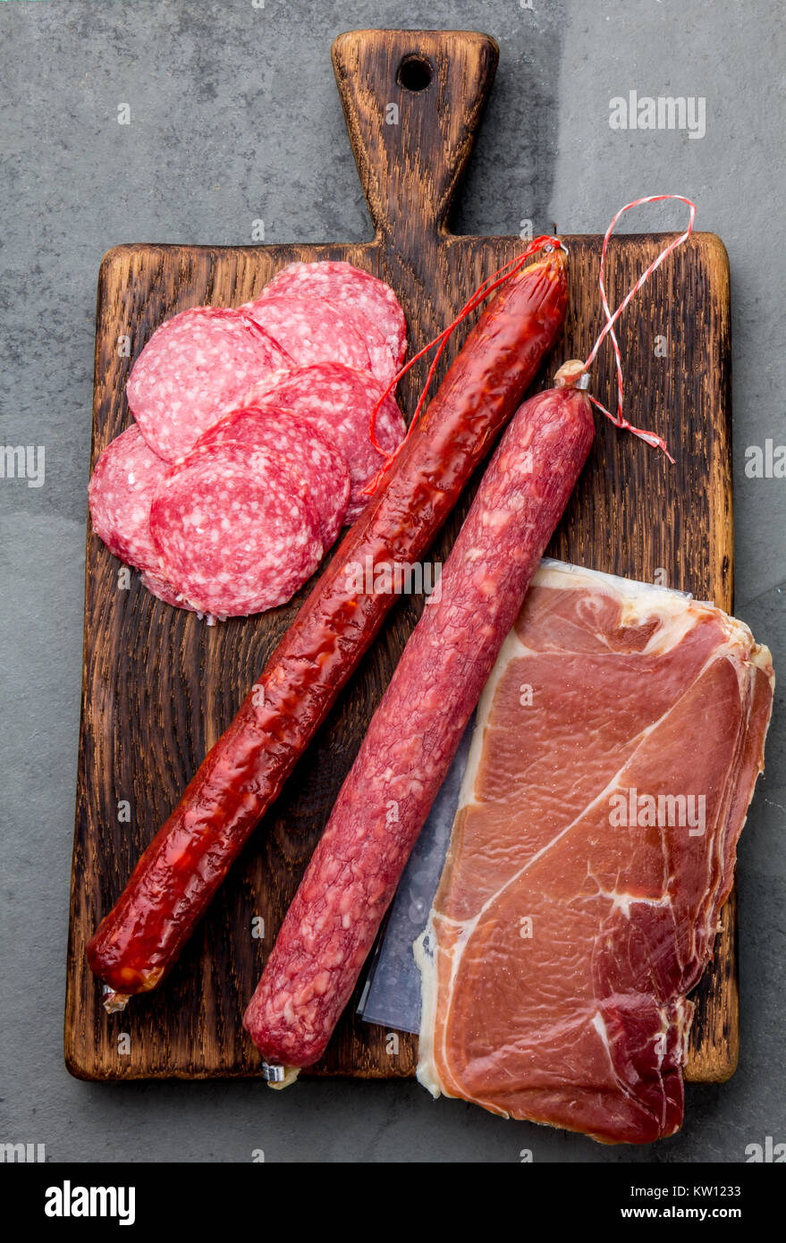 Ham jamon serrano and salami. Spanish tapas Stock Photo - Alamy