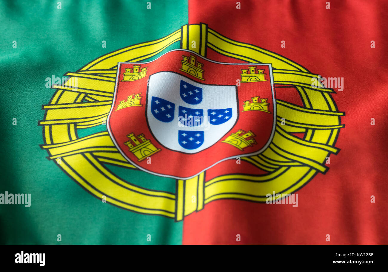 A Portuguese flag is seemingly waving in the wind. The Coat of Arms in ...