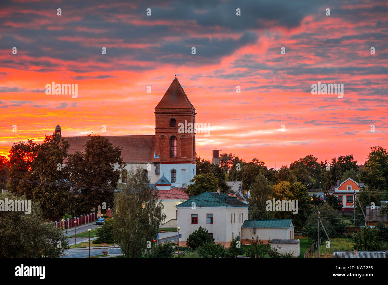 Mir, Belarus. Amazing Sunset Over Landscape Of Village Houses And Saint ...